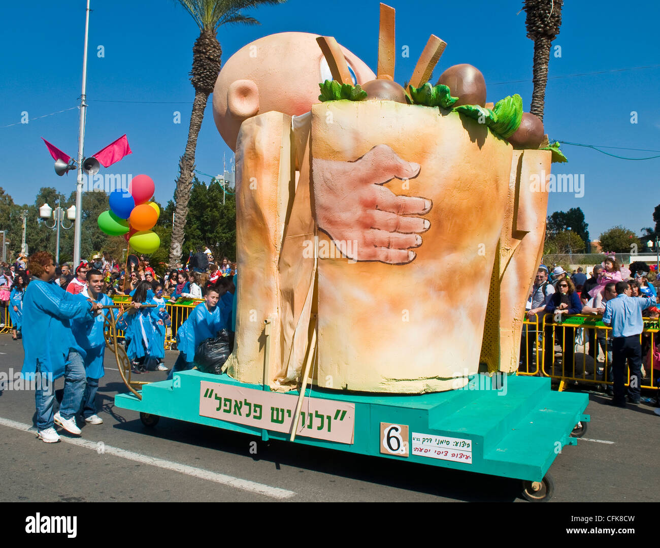 Colorful moving float pass through the street during the Adloyada event ...