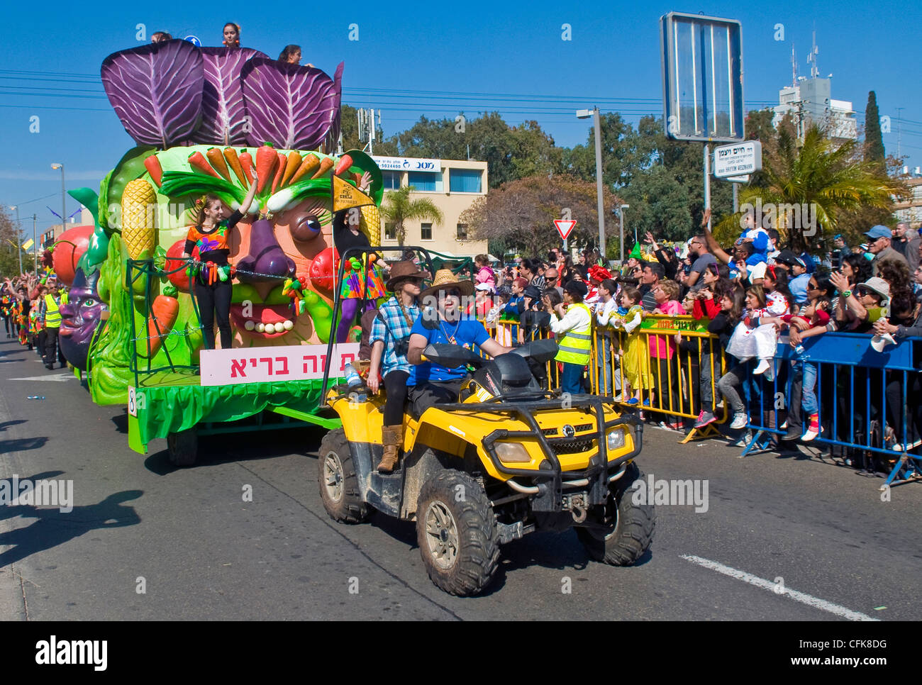 Colorful moving float pass through the street during the Adloyada event ...