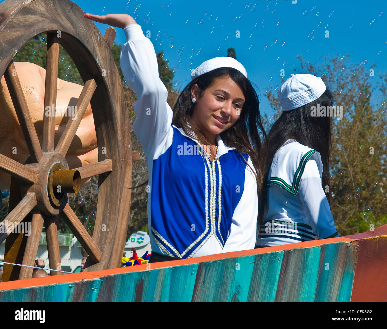 Colorful moving float pass through the street during the Adloyada event ...