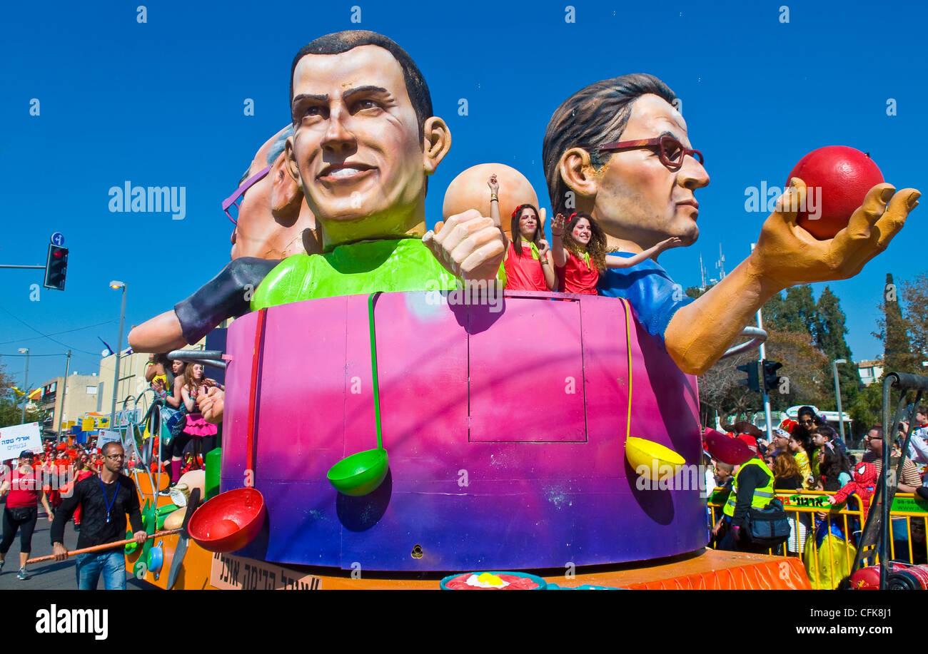 Colorful moving float pass through the street during the Adloyada event ...
