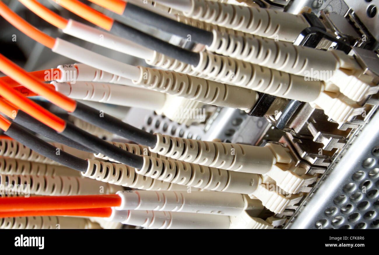 optic fiber cables connected to hub Stock Photo - Alamy