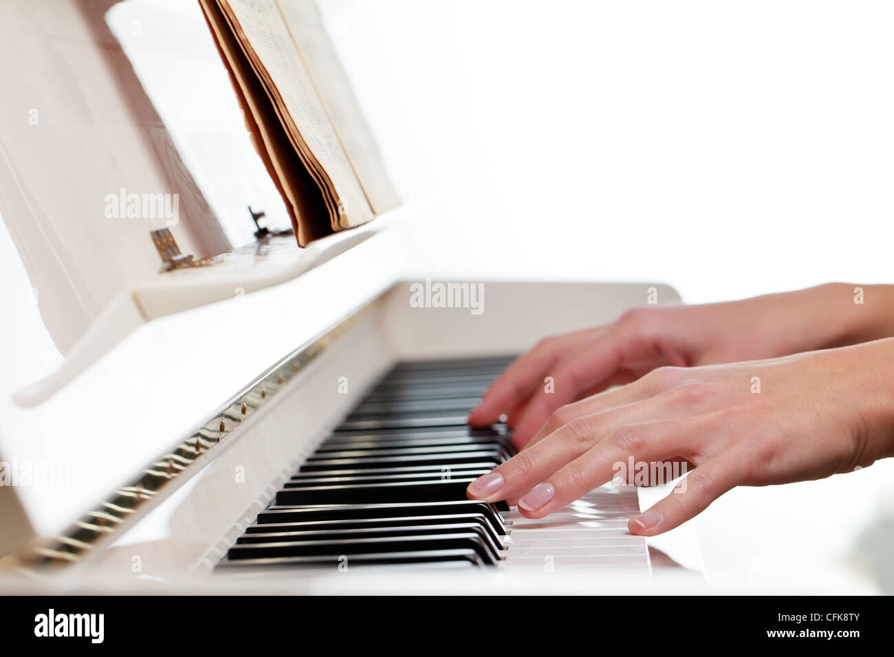 Playing the piano (shallow DOF; color toned image Stock Photo - Alamy