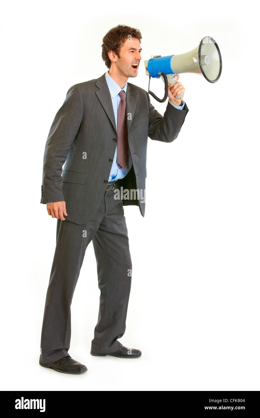 Full length portrait of frustrated modern businessman yelling through ...