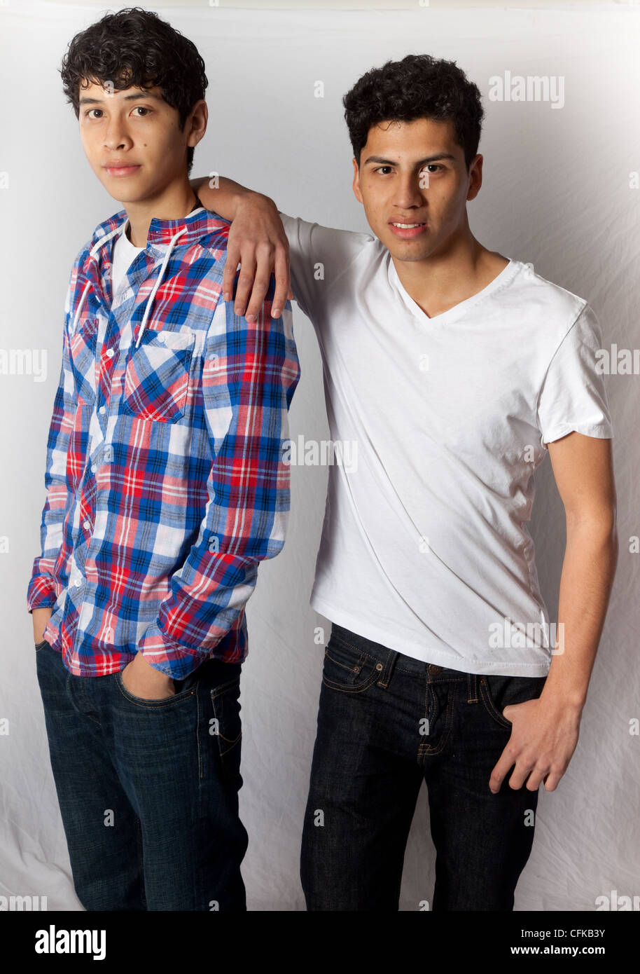 Two hispanic brothers standing casually hi-res stock photography and ...