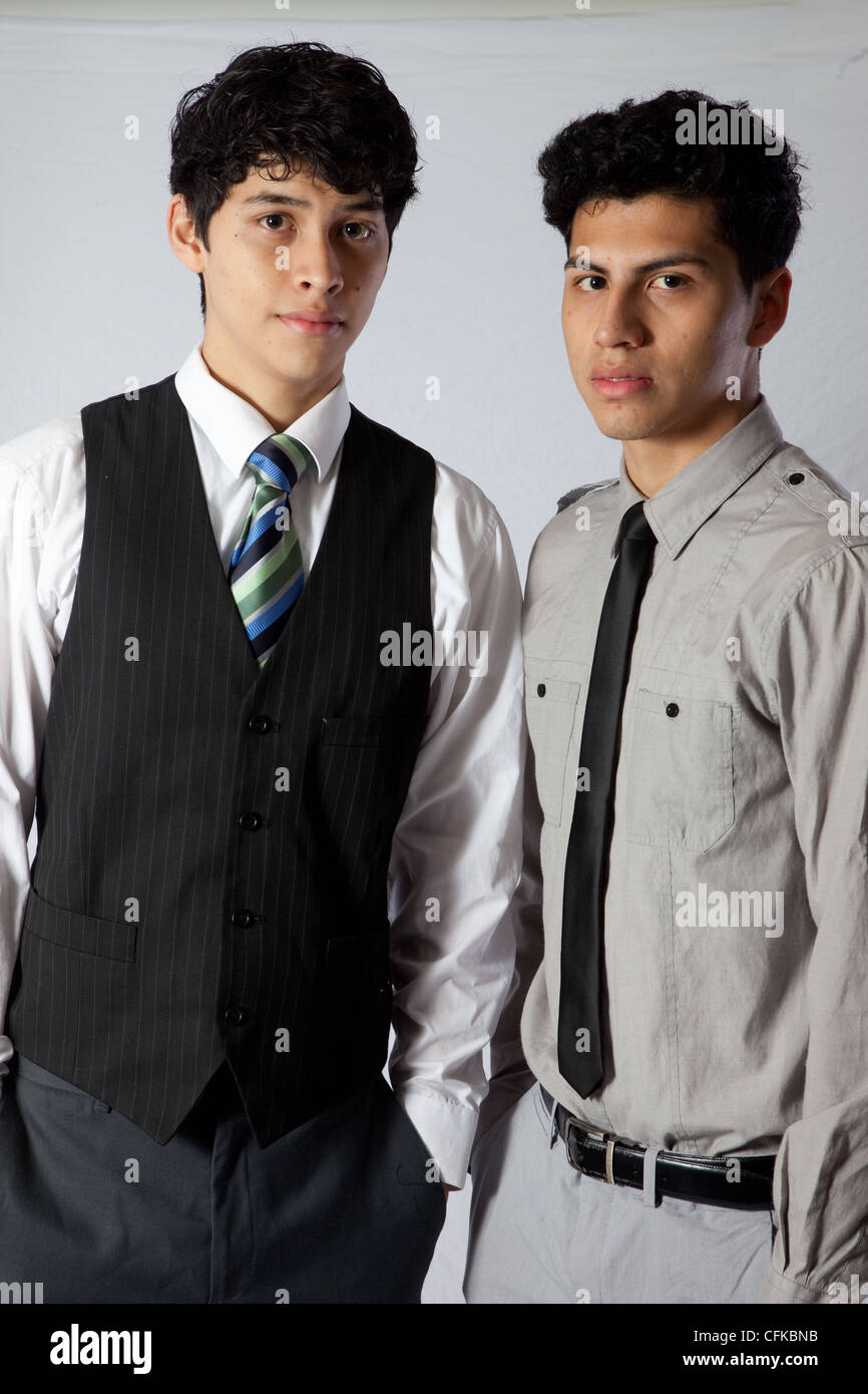 Handsome, young, Hispanic brother, in business dress, looking at the ...