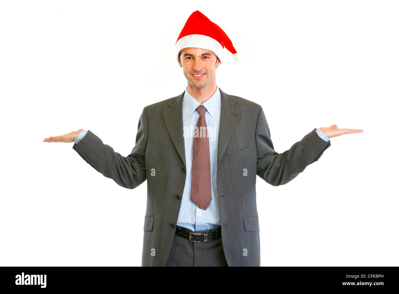 Smiling modern businessman in Santa Hat holding on each side empty ...