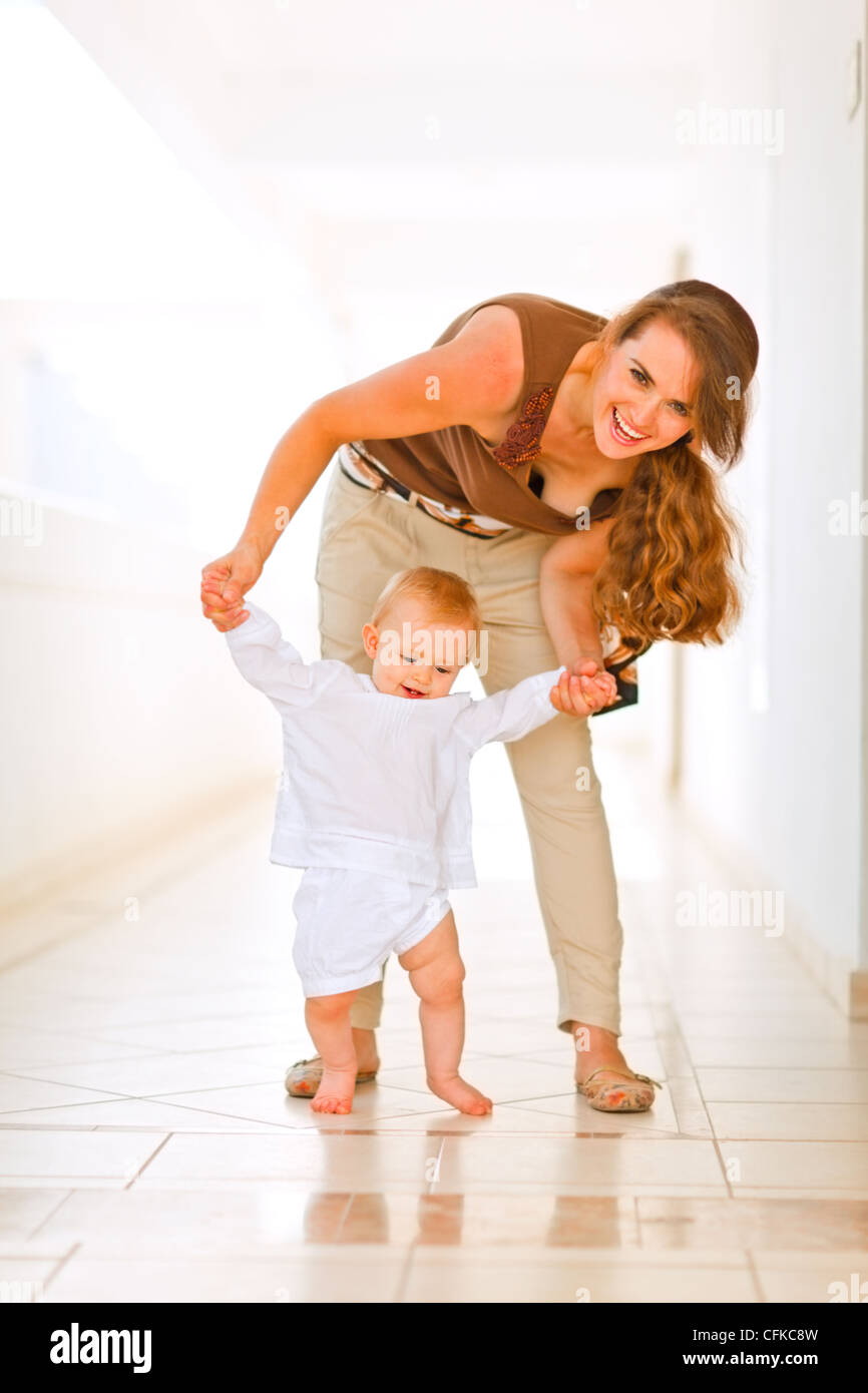 Beautiful woman helping adorable hi-res stock photography and images ...