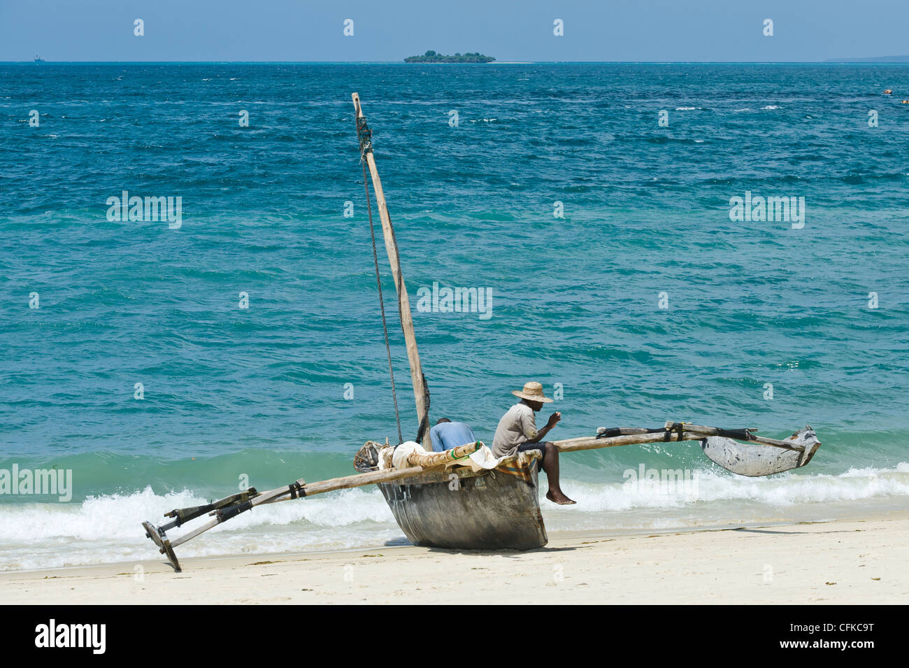 Fishermen with their "Ngalawa" a traditional double-outrigger canoe ...
