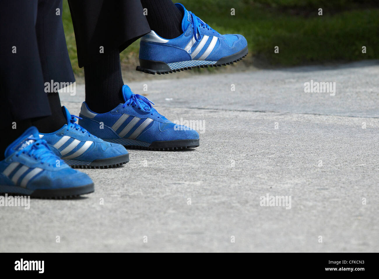Matching Blue Shoes of Couple Sitting on Park Bench Stock Photo - Alamy