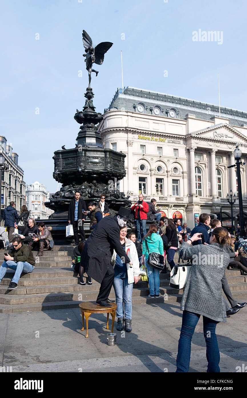 Piccadilly Circus London statue of Eros mime artist poses pretty ...