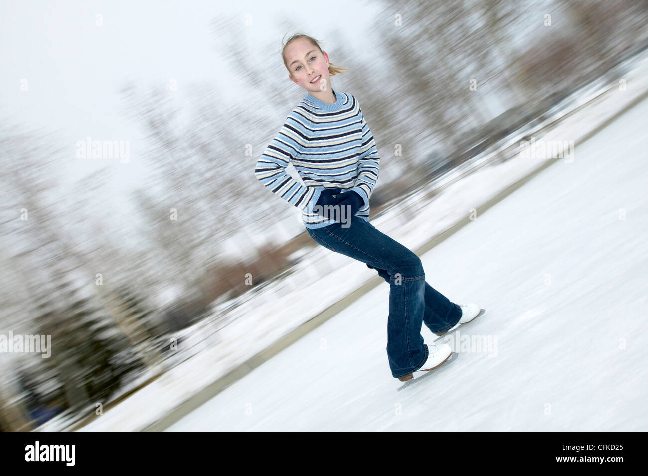 Girl Skating Backwards on Outdoor Skating Rink Stock Photo - Alamy