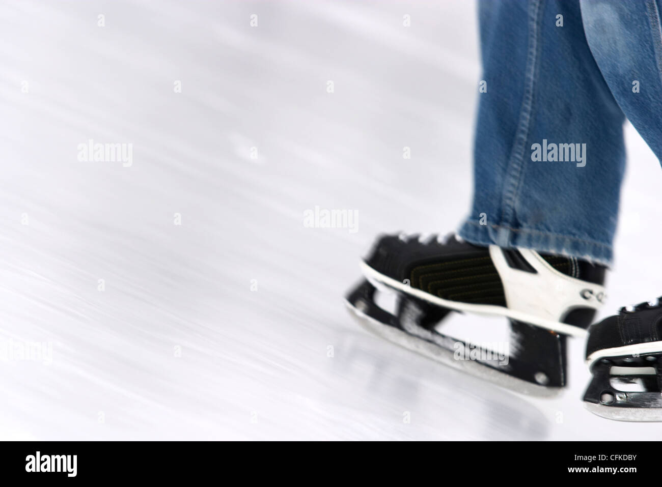 Skates in Motion on Ice Stock Photo - Alamy