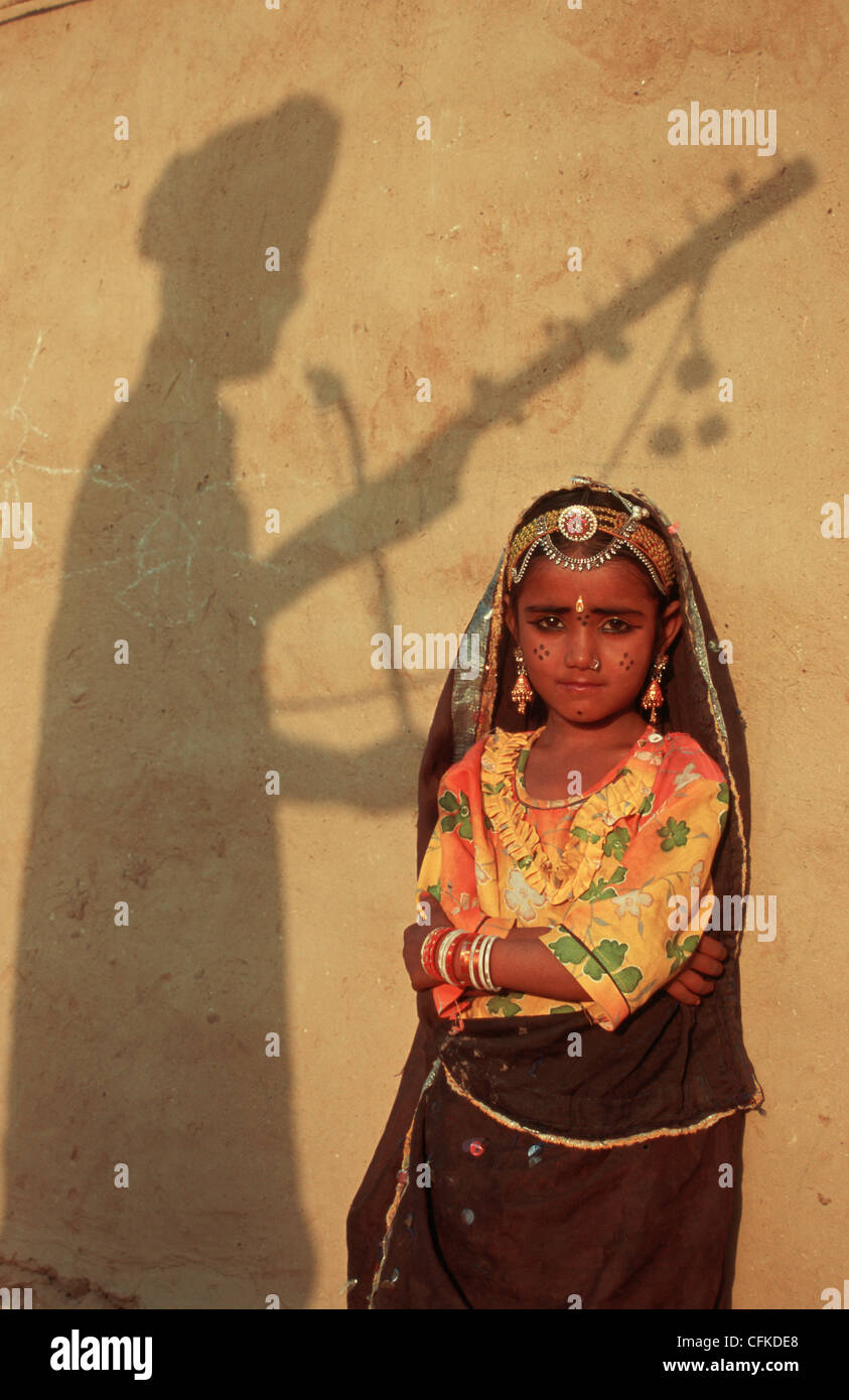 Young dancer girl with the shadow of a musician playing "ravanhatta ...