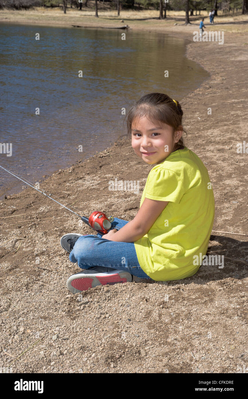 Young Hispanic girl fishing for trout in Bonito Lake, Lincoln National ...