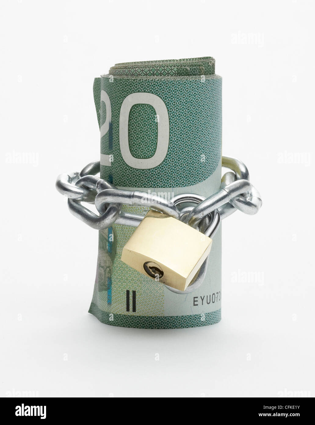 Lock and Chain on rolled up Canadian 20 Dollar Bill Stock Photo - Alamy