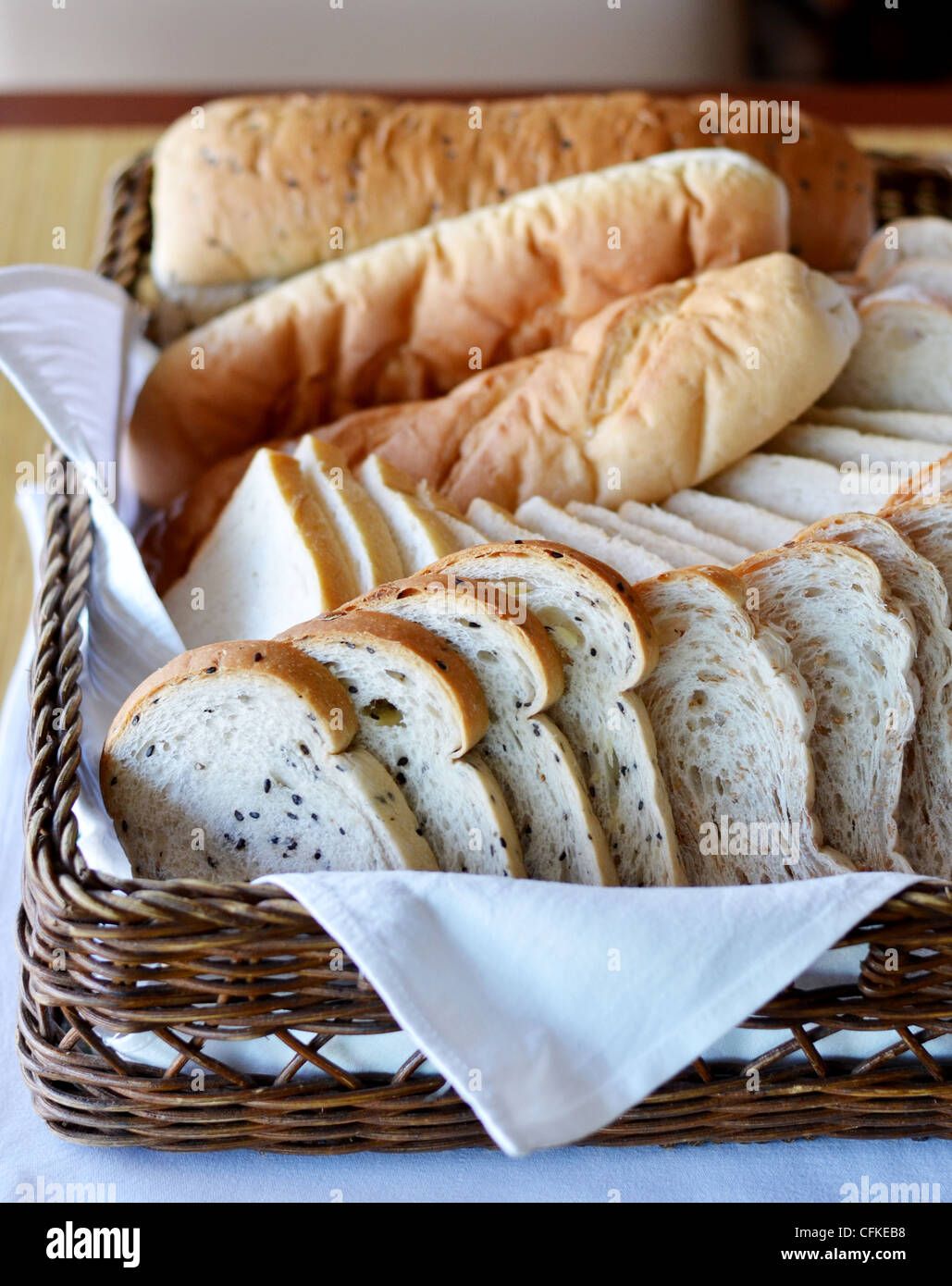 Arrangement of bread in basket on table Stock Photo - Alamy