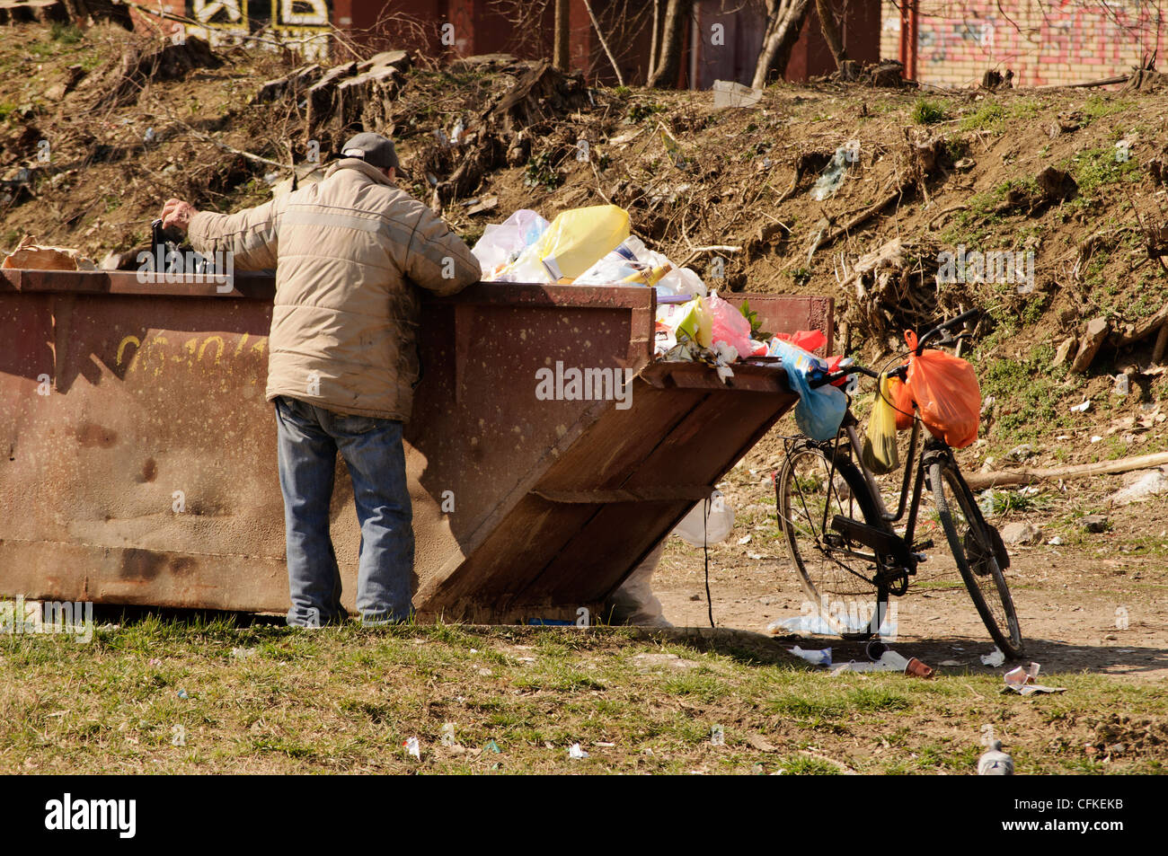 Rummaging through rubbish hi-res stock photography and images - Alamy