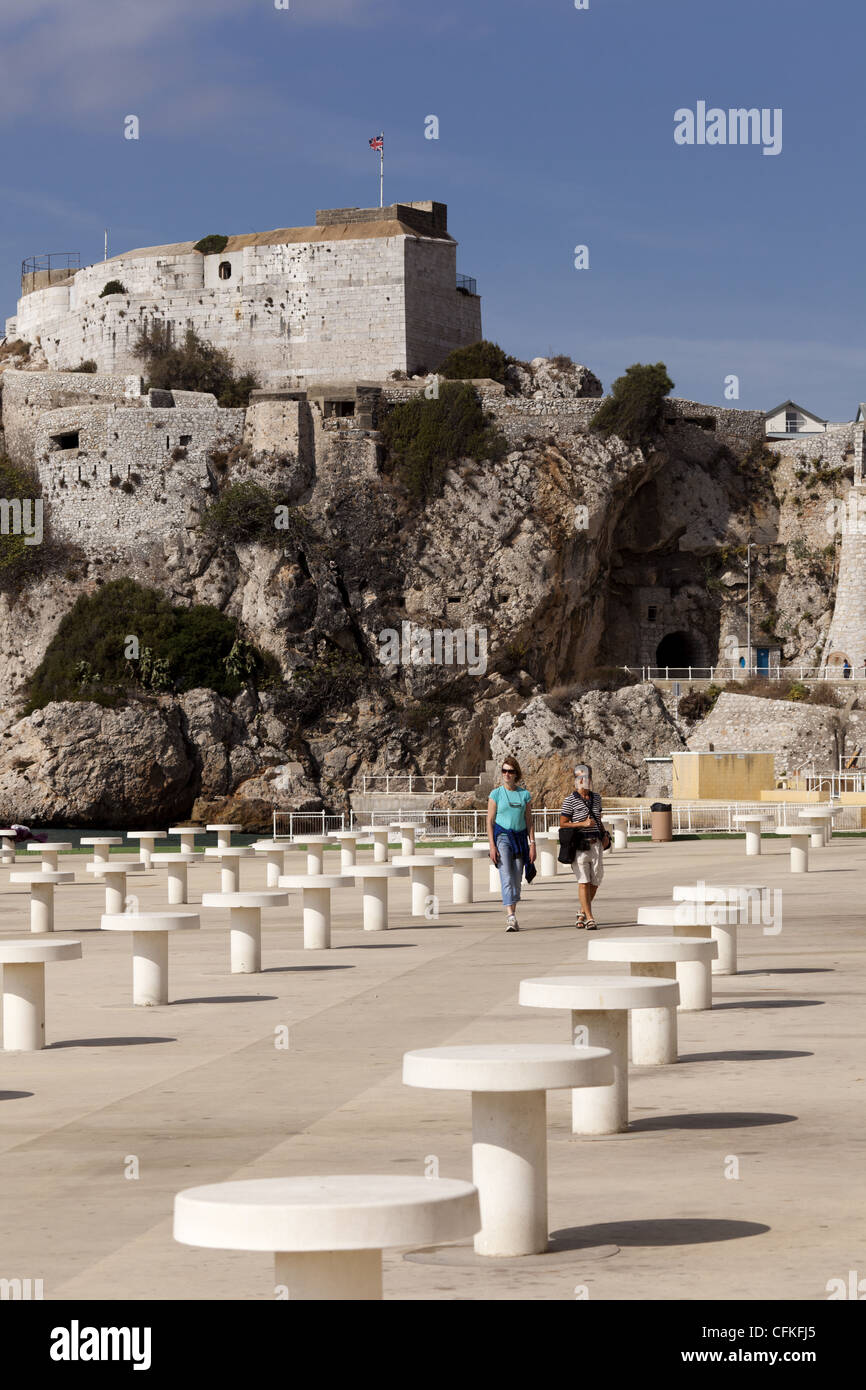 A couple of women walking through Rosia Bay in Gibraltar Stock Photo ...