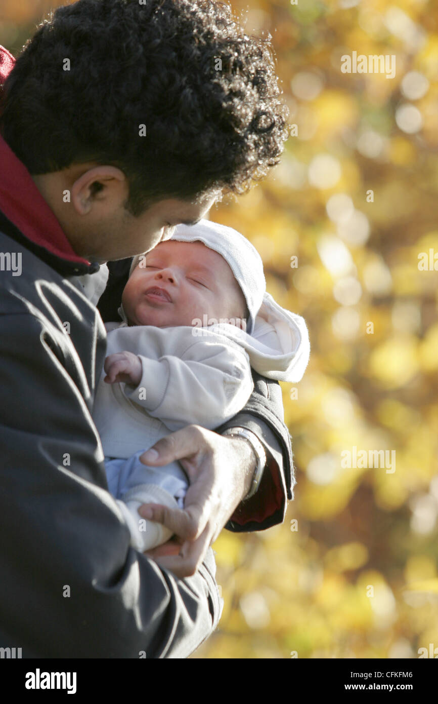 Man holding baby latin american father Stock Photo - Alamy