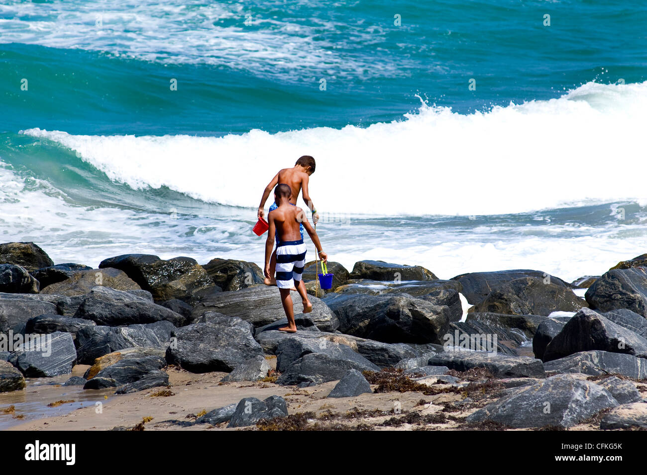 boys exploring beach Stock Photo - Alamy