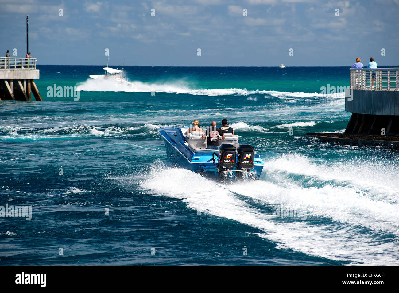 Blue speedboat leaving harbor hi-res stock photography and images - Alamy