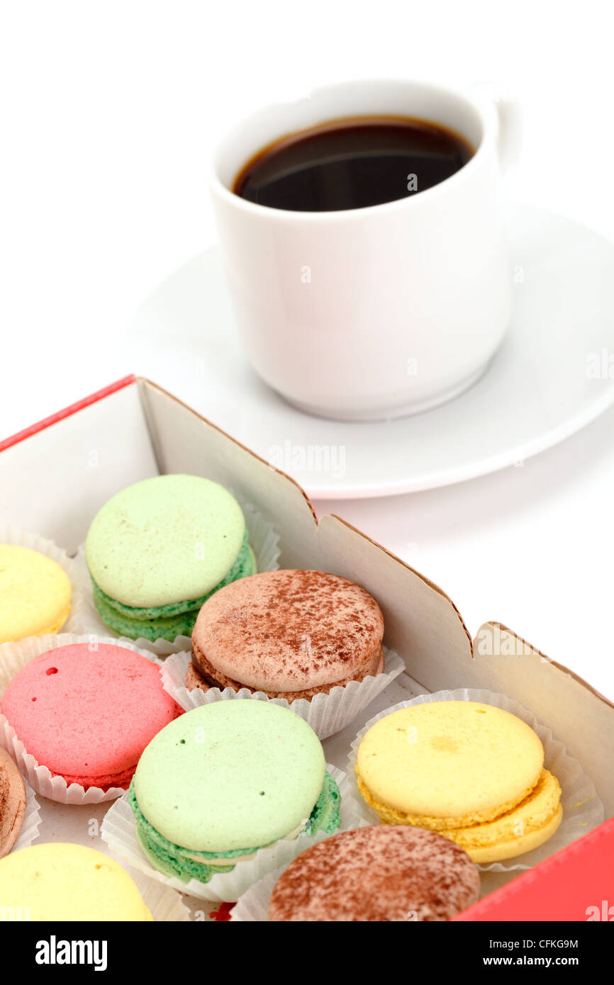 Colorful Macaroon and cup of coffee on white background Stock Photo - Alamy
