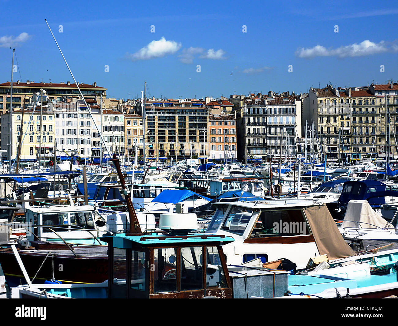 Many boats and buildings in the old port of Marseilles, France, by ...