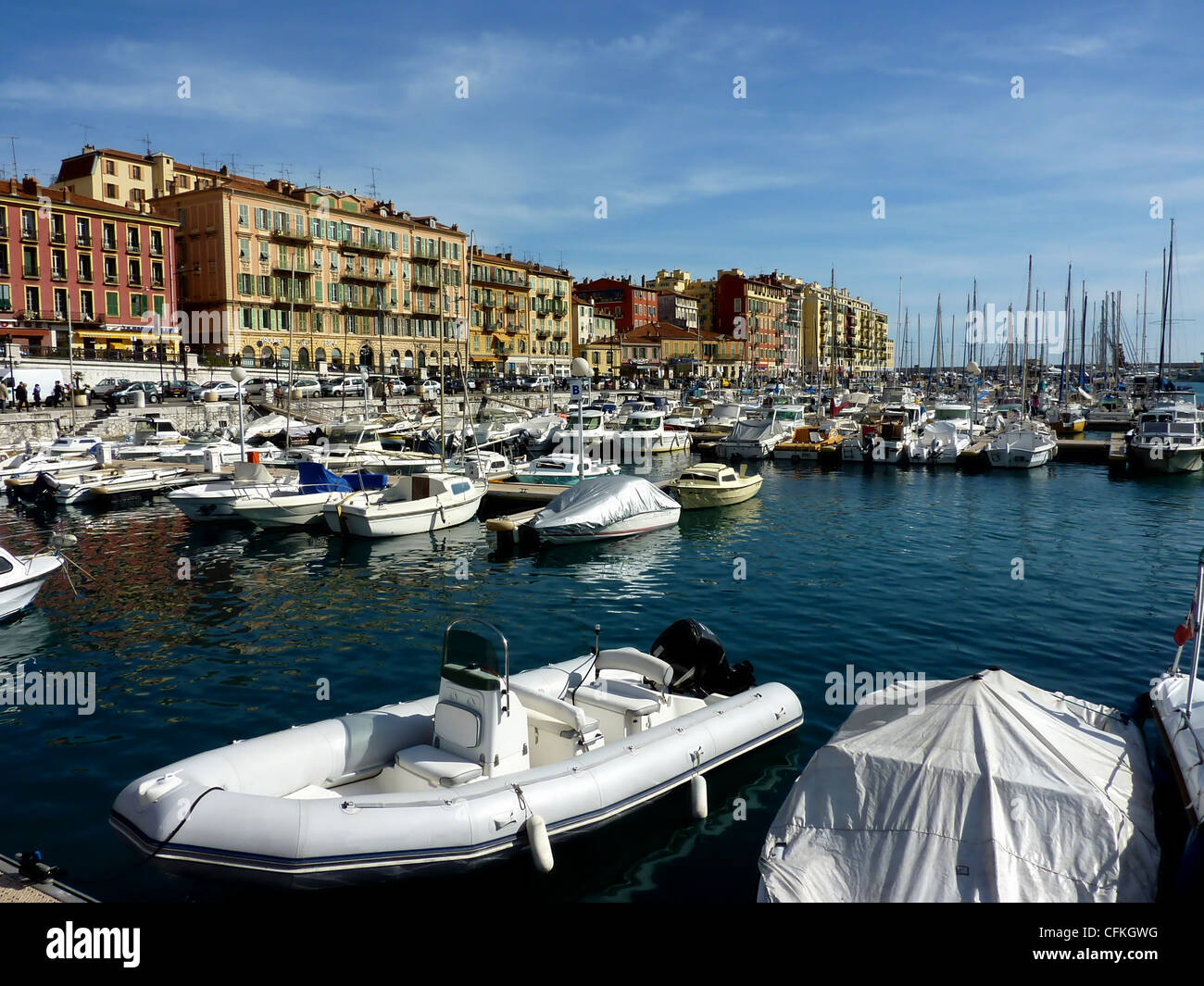 View of the boats and colored buildings at the old port of Nice, France ...