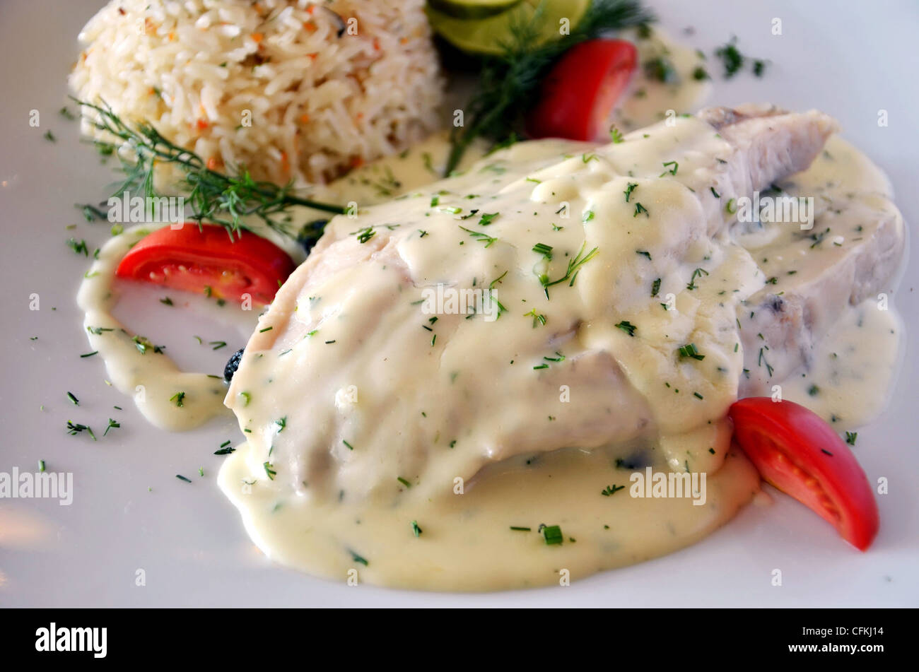 steak from fish with creamy sauce Stock Photo - Alamy