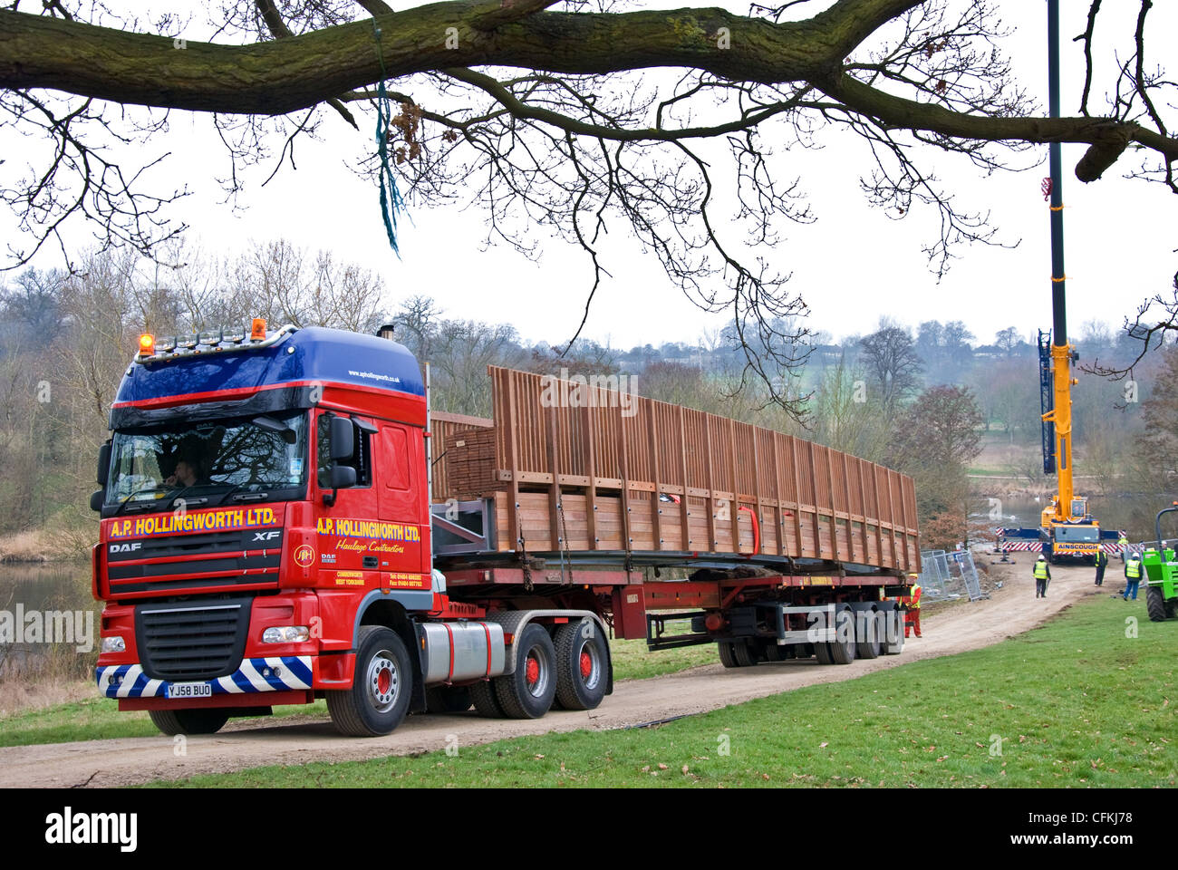 Lorry carrying bridge parts Stock Photo - Alamy