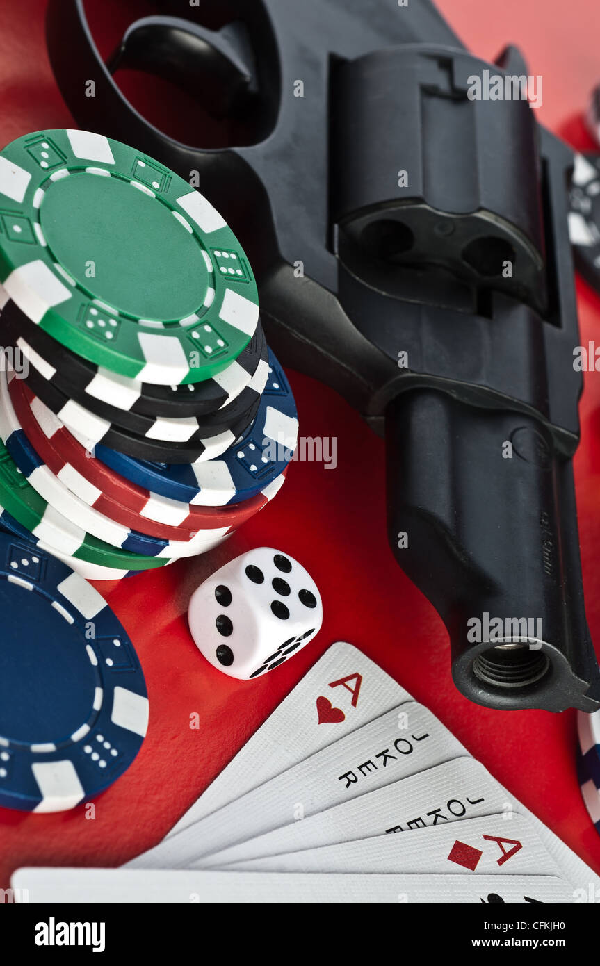 Casino. revolver, cards and counters Stock Photo - Alamy