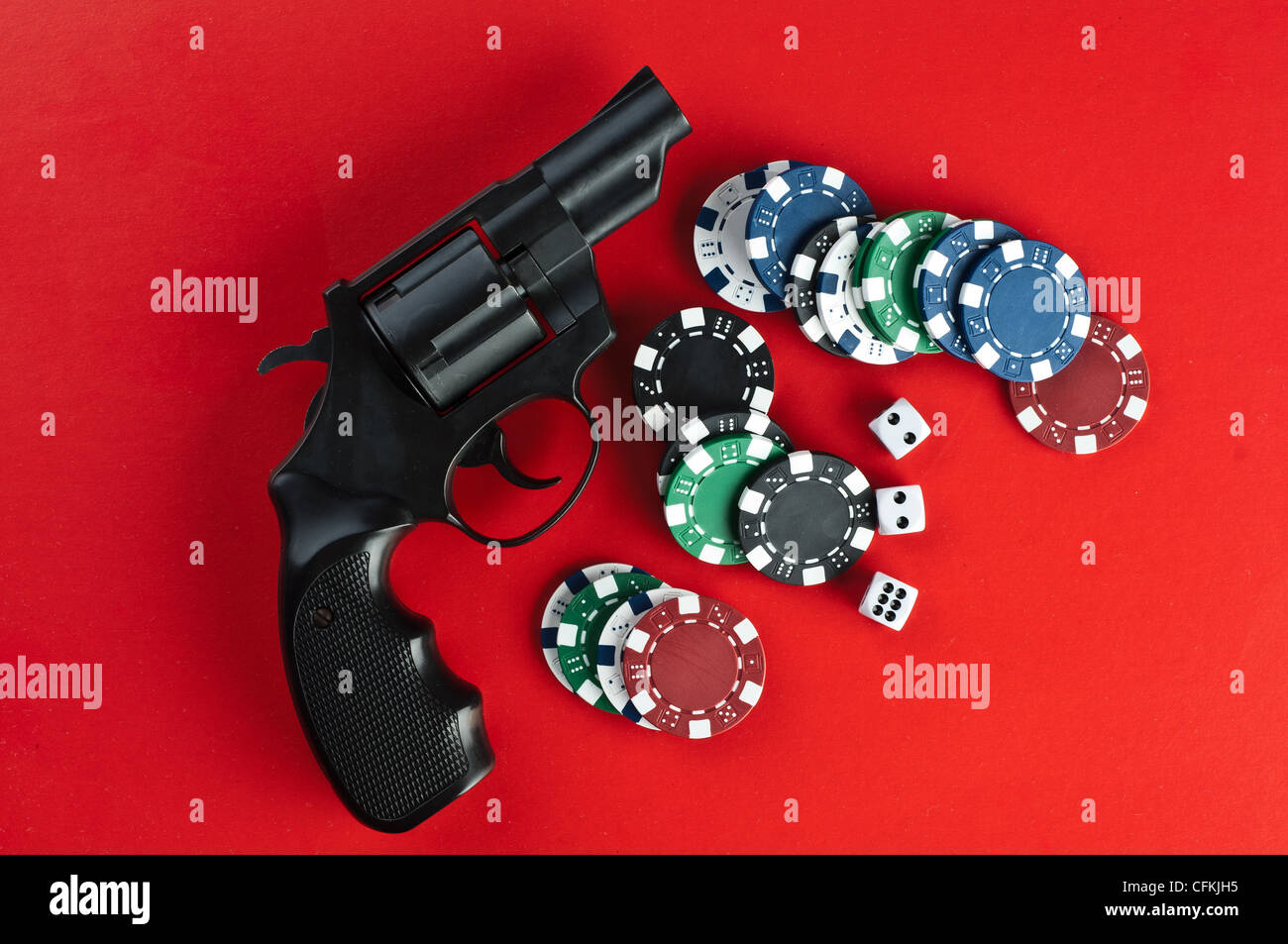 Casino. revolver, cards and counters Stock Photo - Alamy