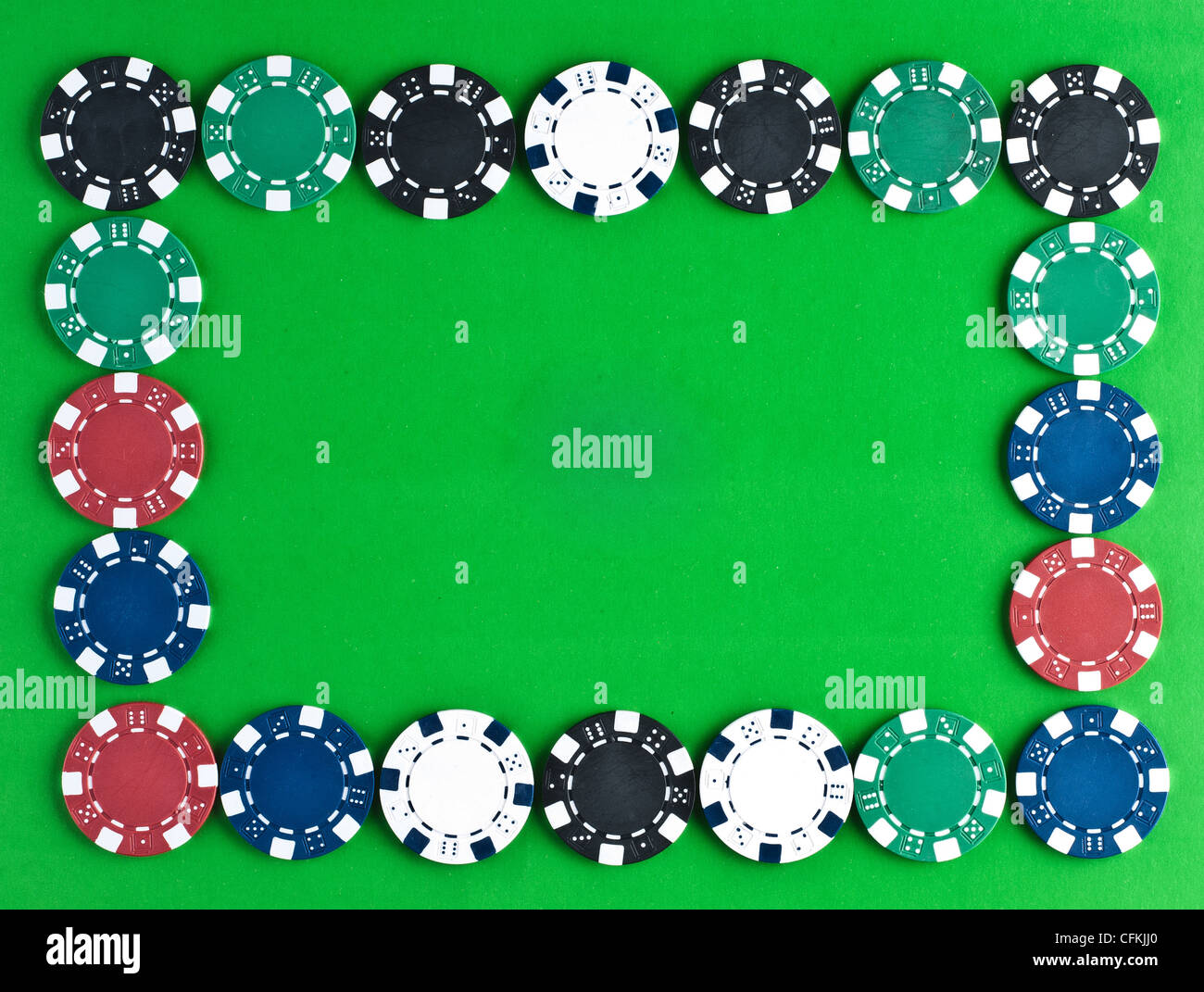 Counters for game in a casino on green a background Stock Photo - Alamy