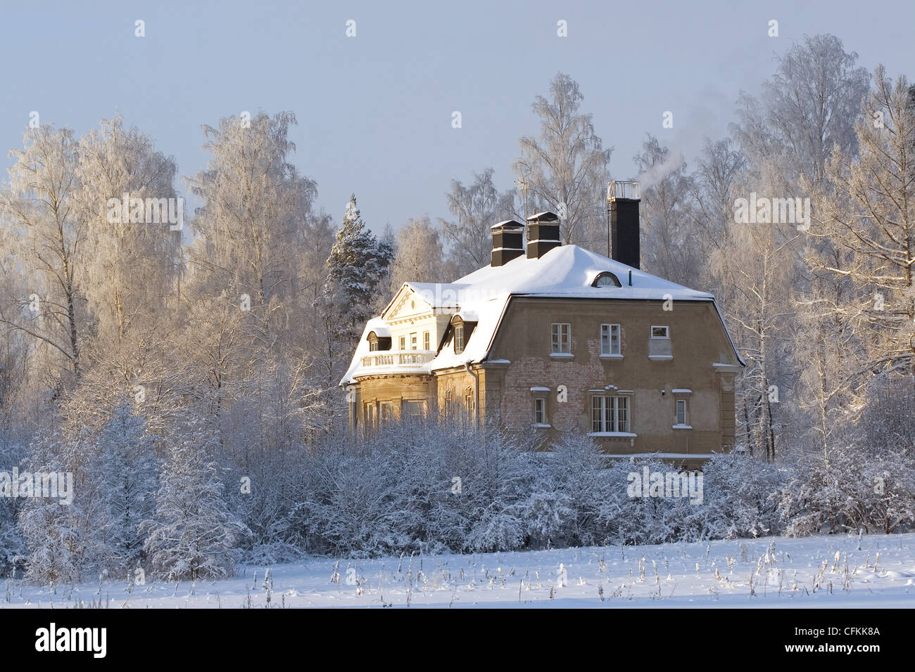 Old house covered in snow and surrounded by frosty trees Stock Photo ...