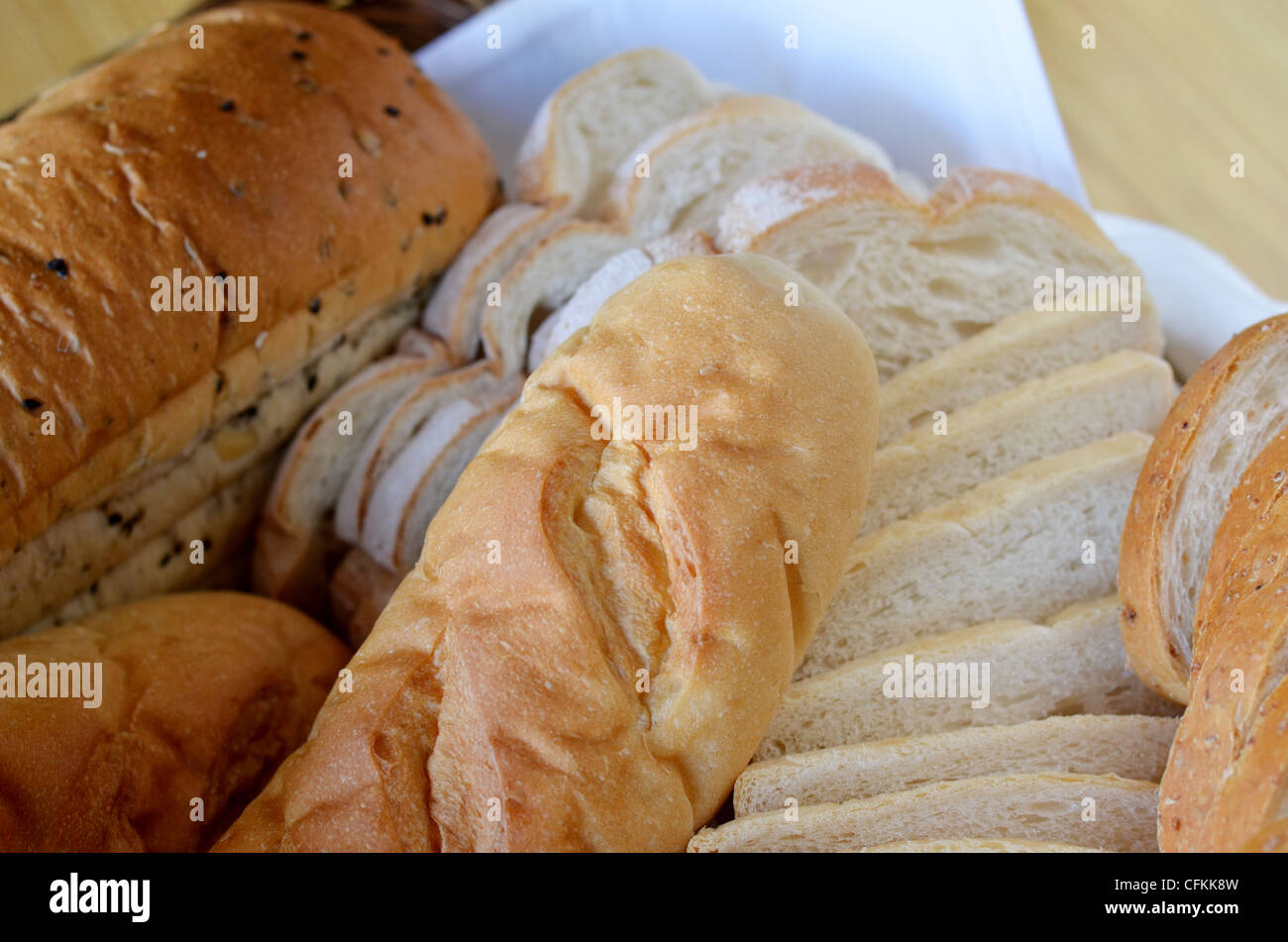 Arrangement of bread in basket on table Stock Photo - Alamy