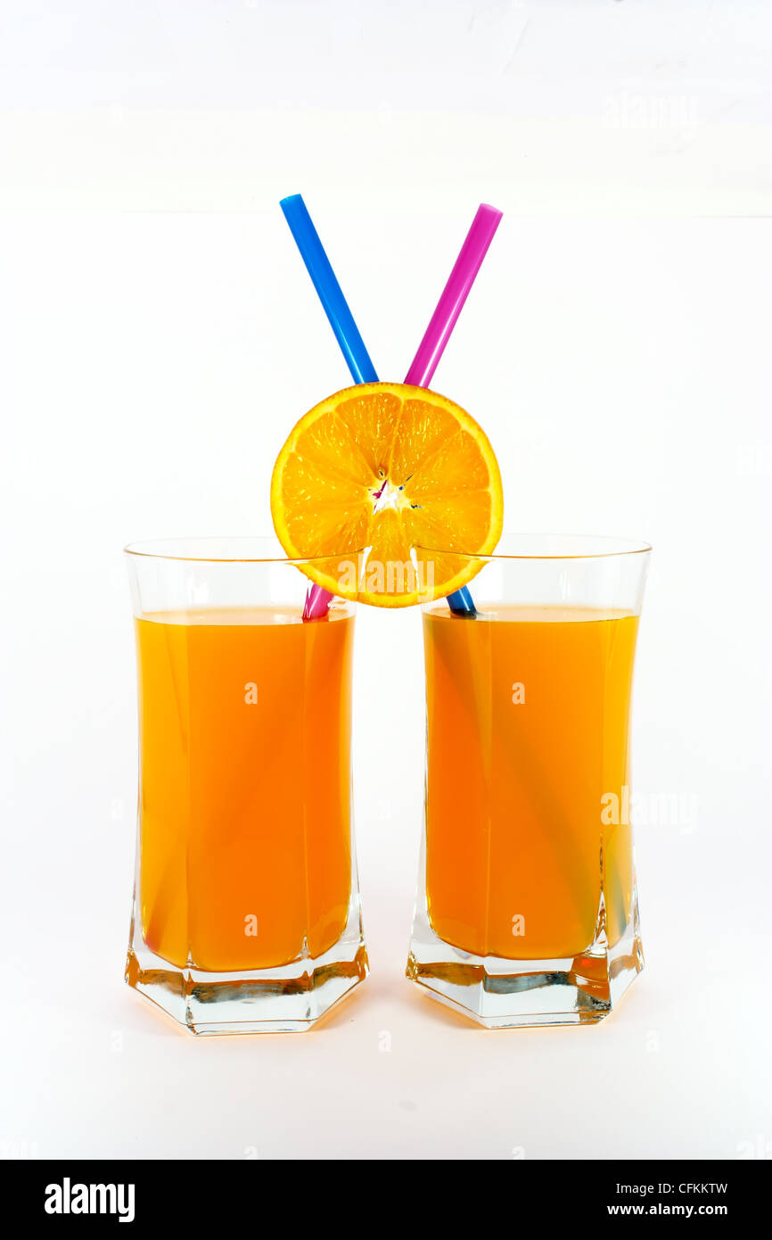 Two glasses of fresh orange juice isolated on white Stock Photo - Alamy