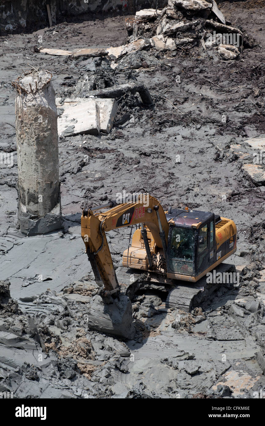 Mechanical Excavator Working in Mud Stock Photo - Alamy