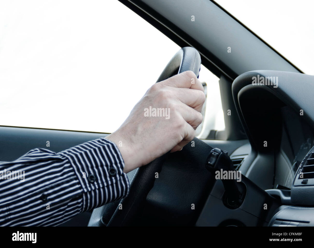 car driver with two hand on the steering wheel Stock Photo - Alamy