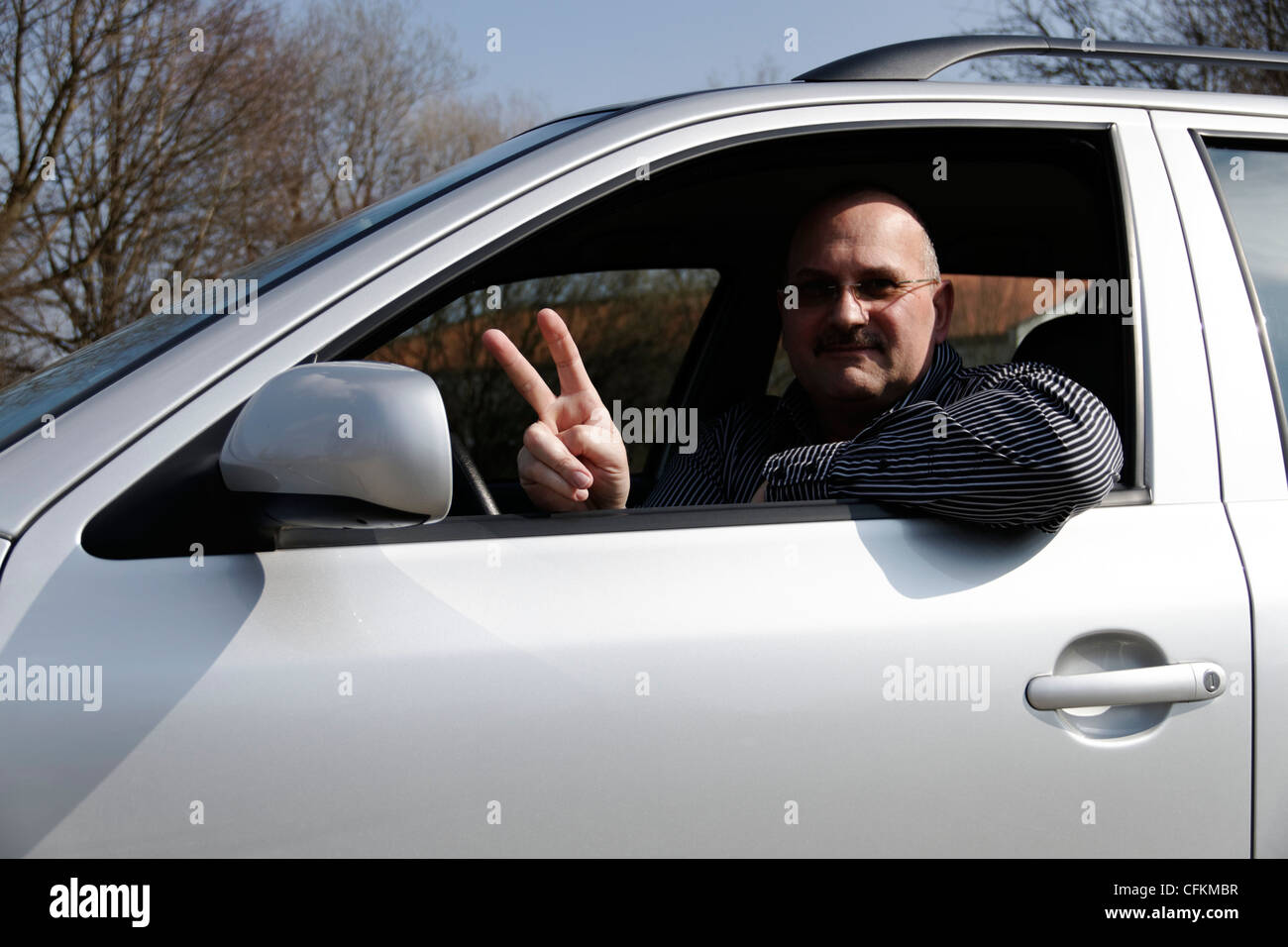friendly car driver on the road Stock Photo - Alamy