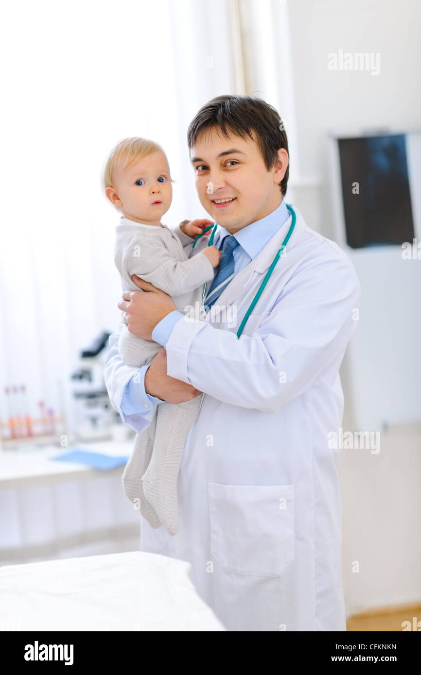 Portrait of happy cute baby on hands of pediatrician Stock Photo - Alamy
