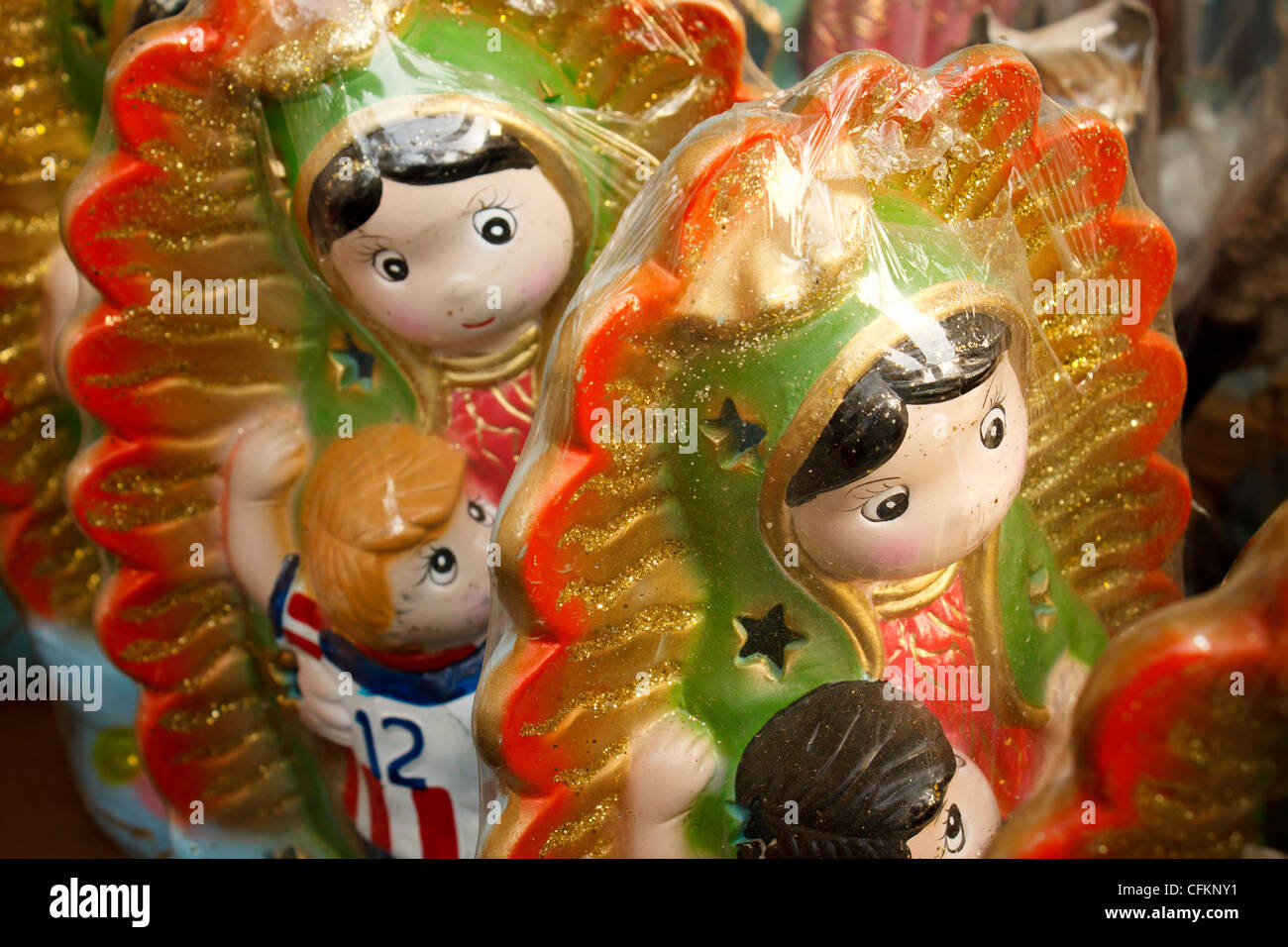 Colorful Virgin Mary figurines for sale in Mexican market Stock Photo ...