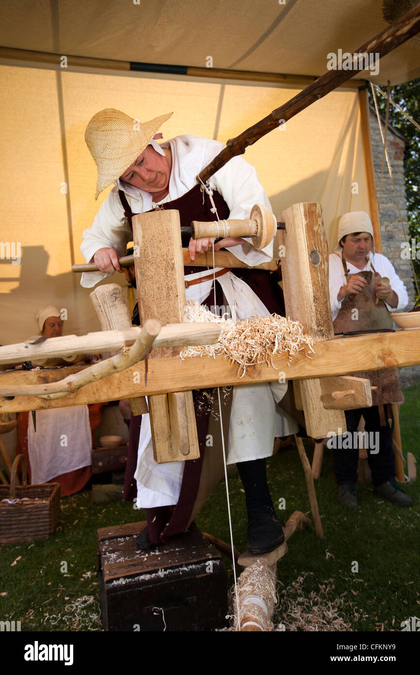 Warwickshire, Wilmcote, Mary Arden’s Farm, women turning wood on ...