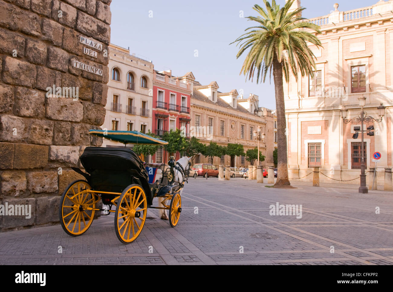 Spanish horse drawn carriage in a plaza in Seville, Spain Stock Photo ...