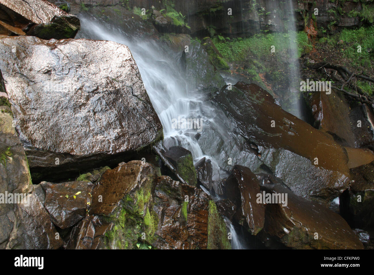 water hitting the rocks at the bottom of a waterfall Stock Photo - Alamy