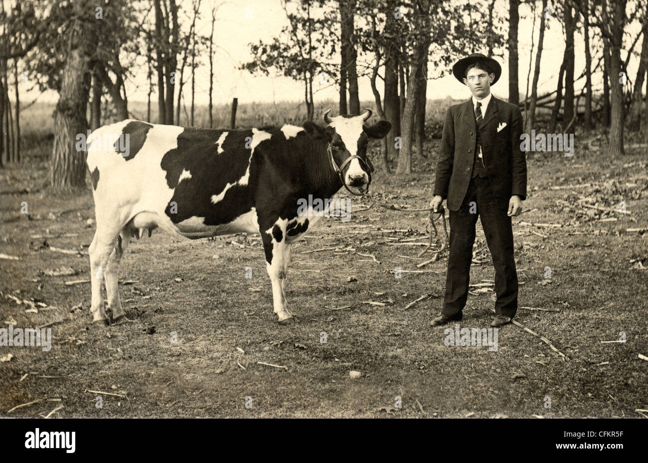 Holstein Cow & Young Owner Stock Photo - Alamy