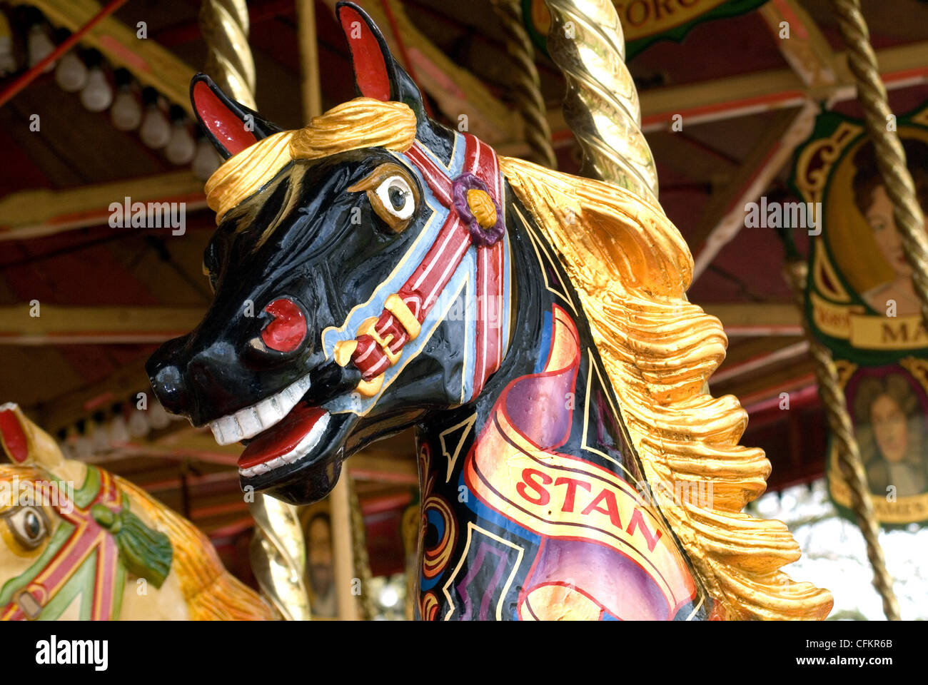 Wooden horse at a fun fair Stock Photo - Alamy