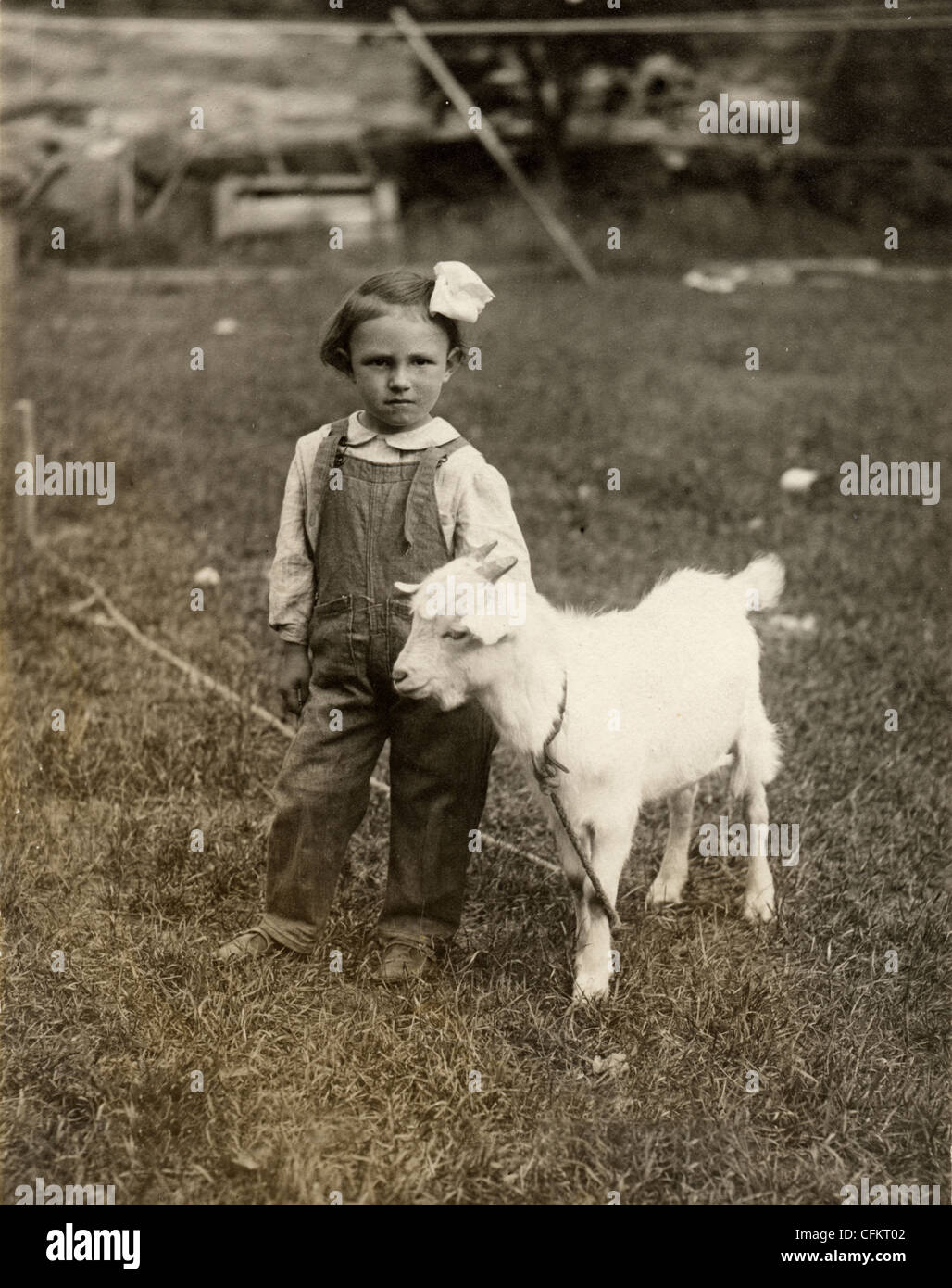 Little Kid with Little Kid Goat Stock Photo - Alamy