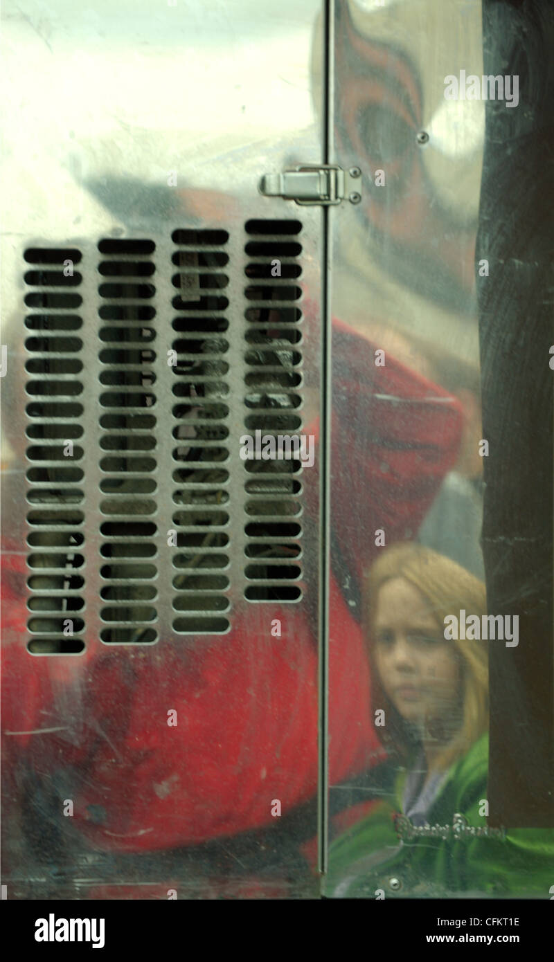 Young girl's face reflected in a shiny subway train door Stock Photo ...