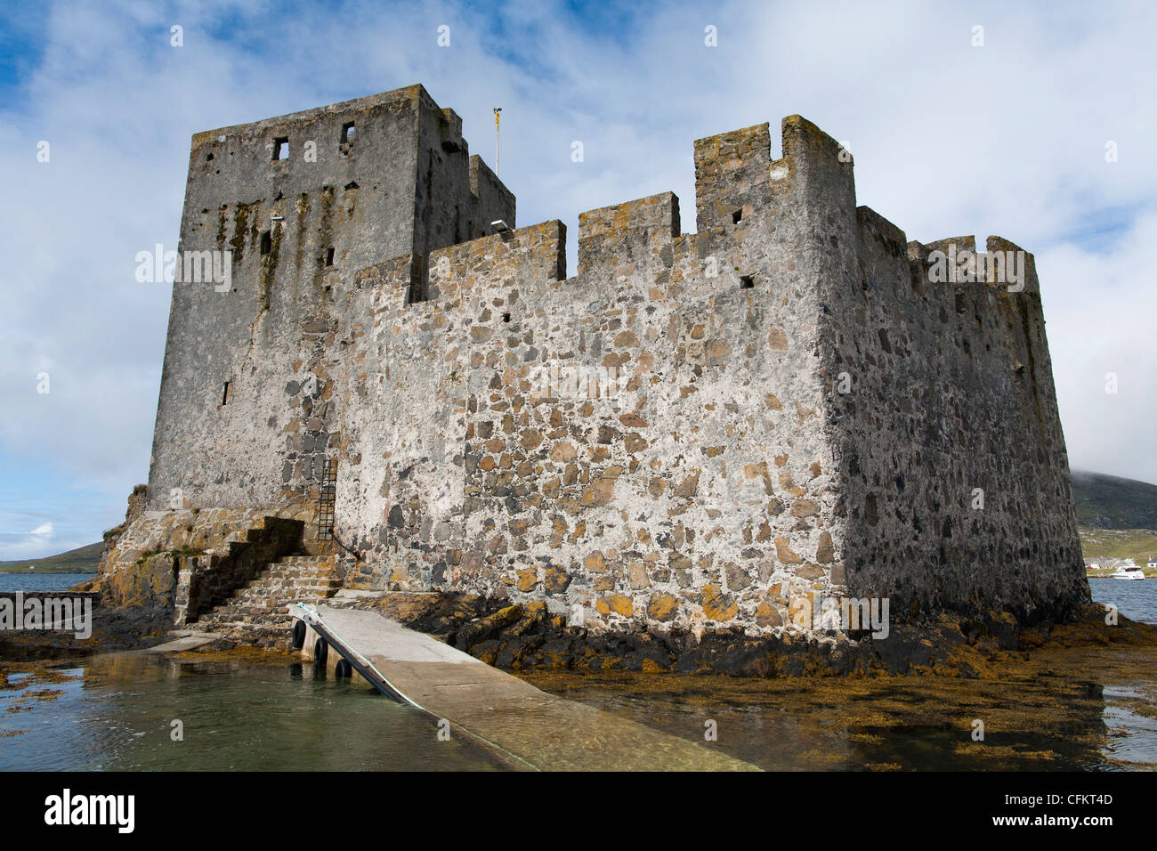 Kisimul Castle seen from the water is located in the bay of Castlebay ...