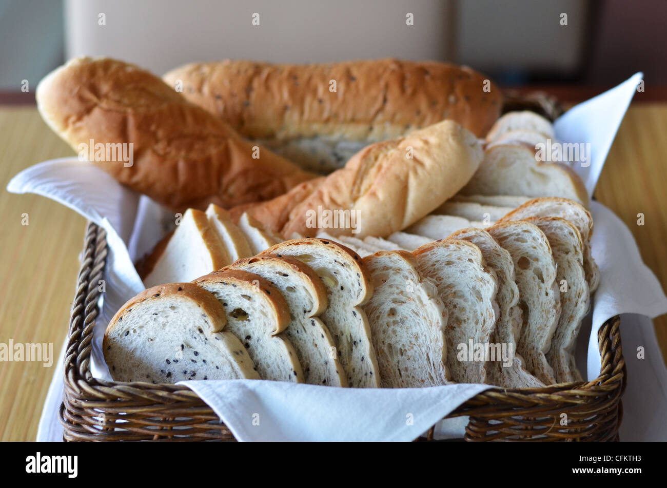 Arrangement of bread in basket on table Stock Photo - Alamy